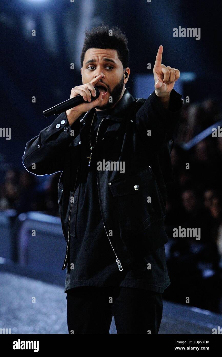 EDITORIAL USE ONLY. The Weeknd performs during the runway at the ...