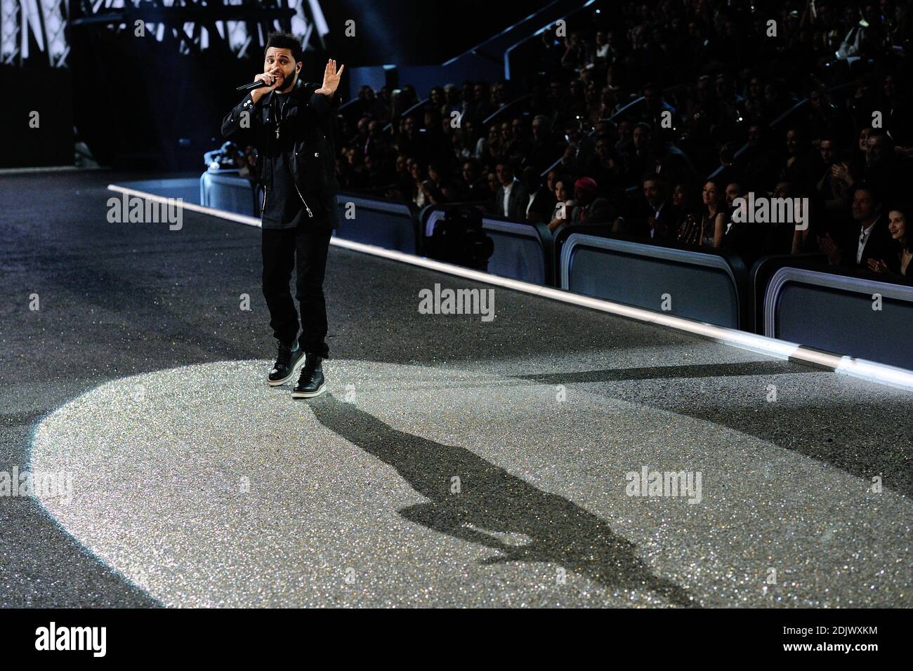 EDITORIAL USE ONLY. The Weeknd performs during the runway at the ...