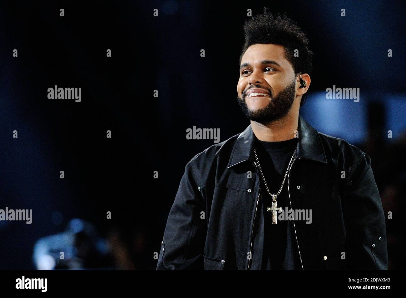 EDITORIAL USE ONLY. The Weeknd performs during the runway at the ...