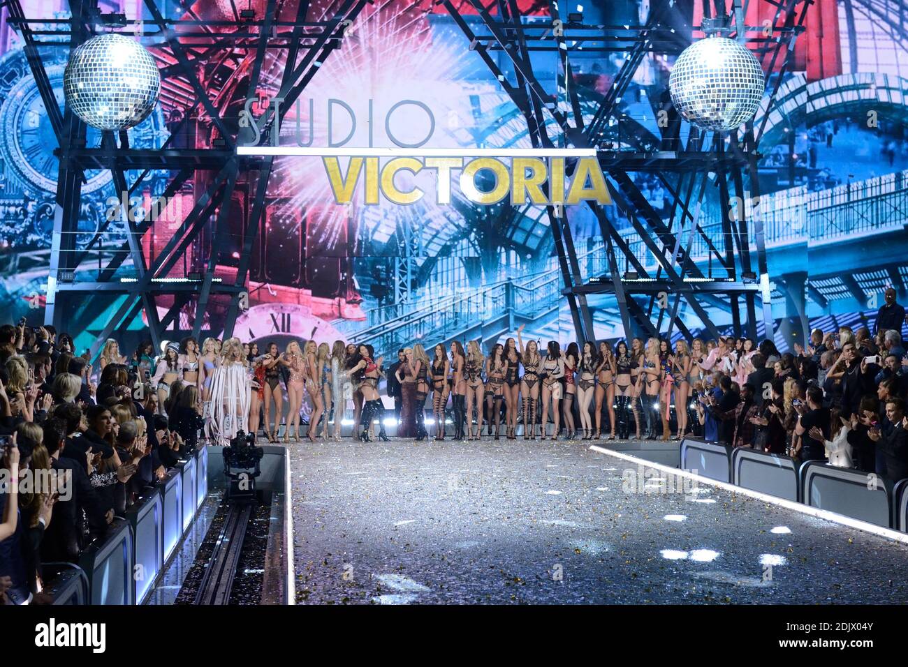 EDITORIAL USE ONLY. Group shot of the models walking on the runway at ...