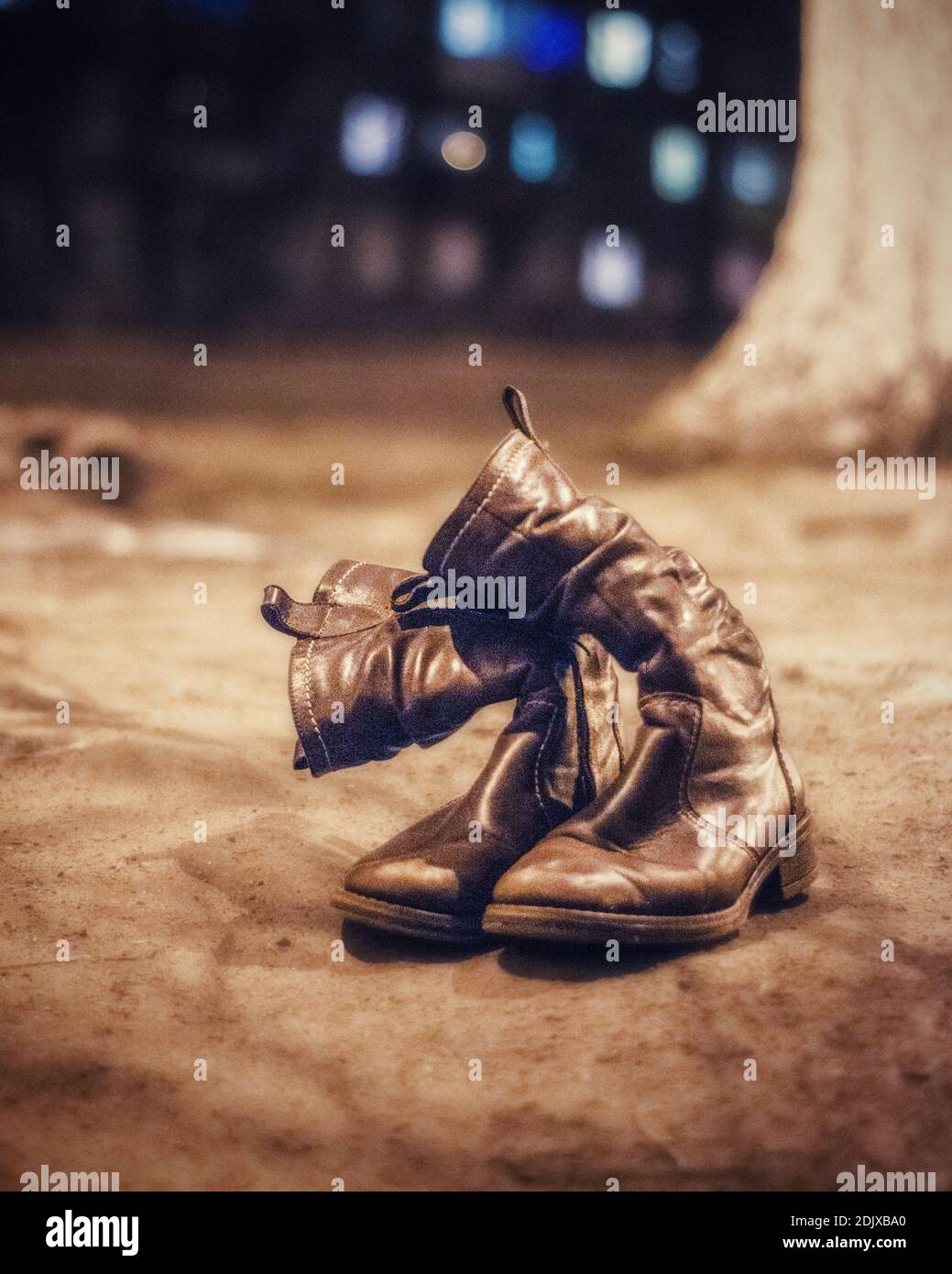 Black boot on the street hi-res stock photography and images - Alamy