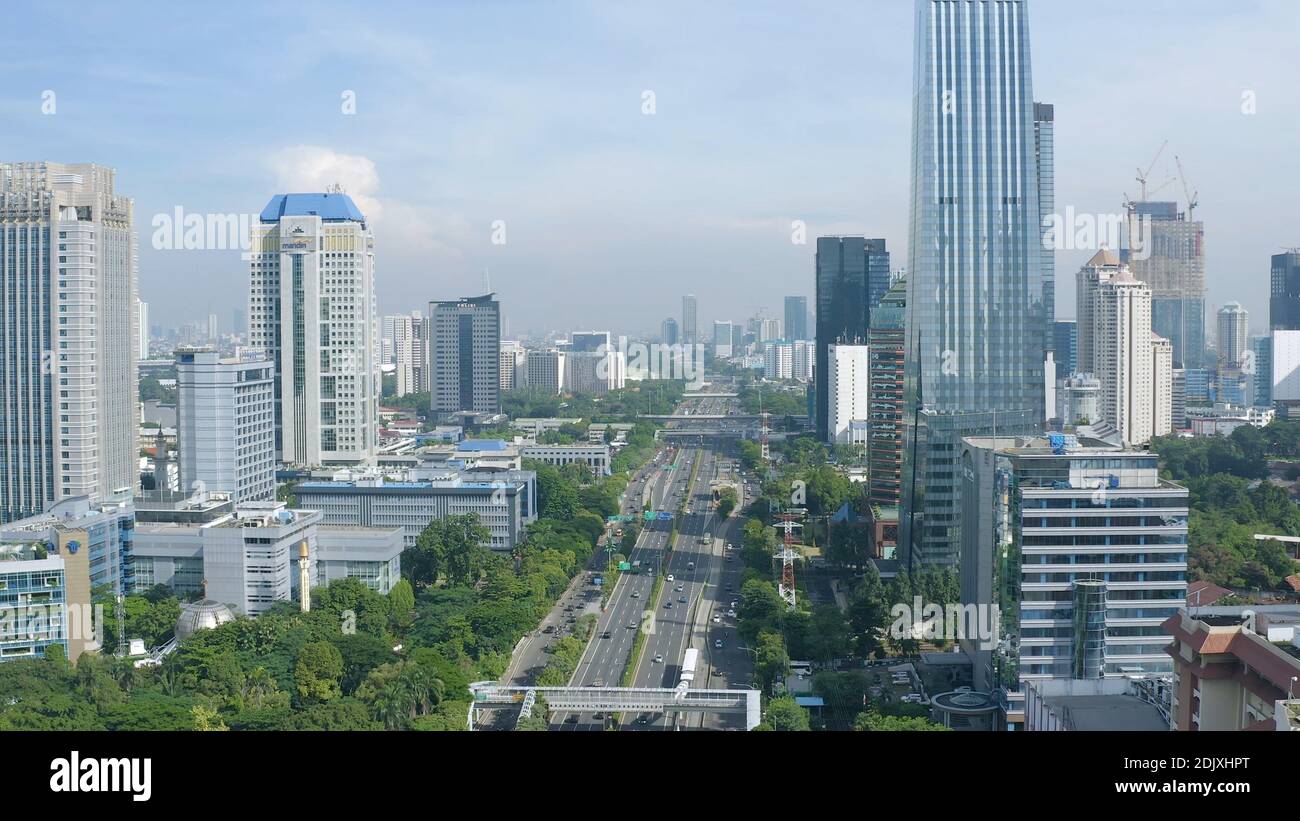 An aerial shot of the beautiful modern city with buildings and greenery ...