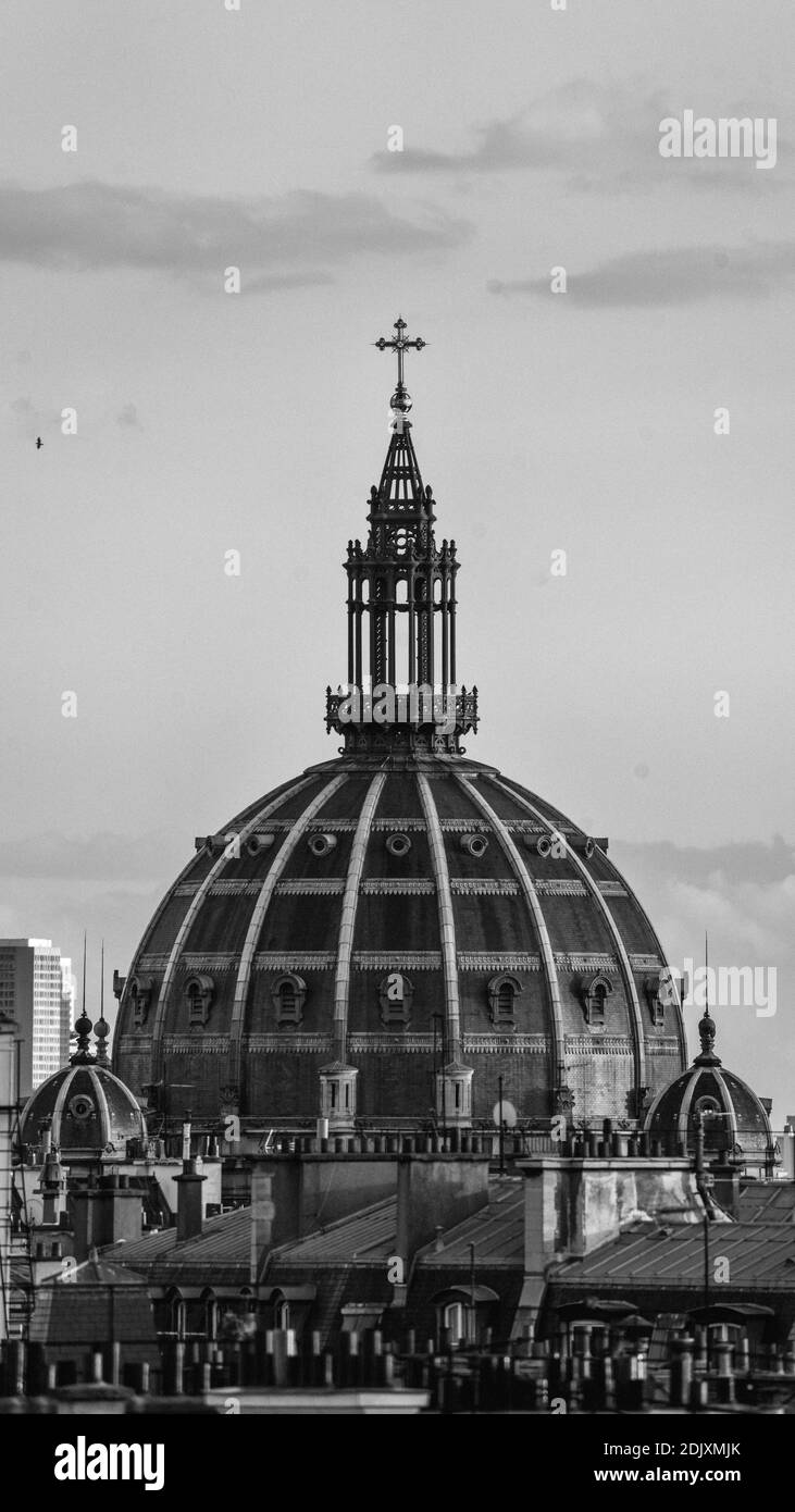 A grayscale shot of the church tower on the grey sky background Stock ...