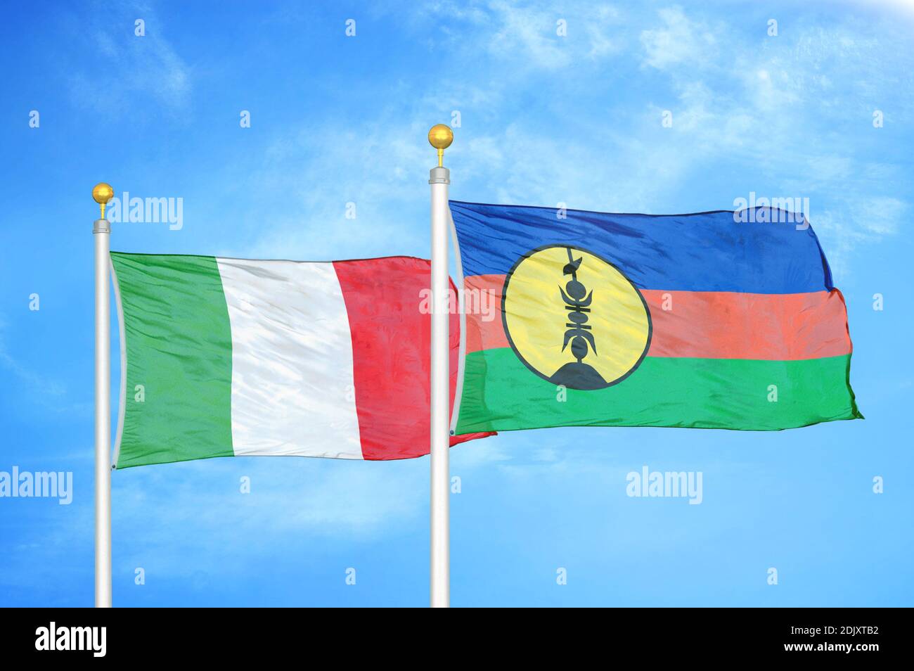 Italy and New Caledonia two flags on flagpoles and blue cloudy sky ...