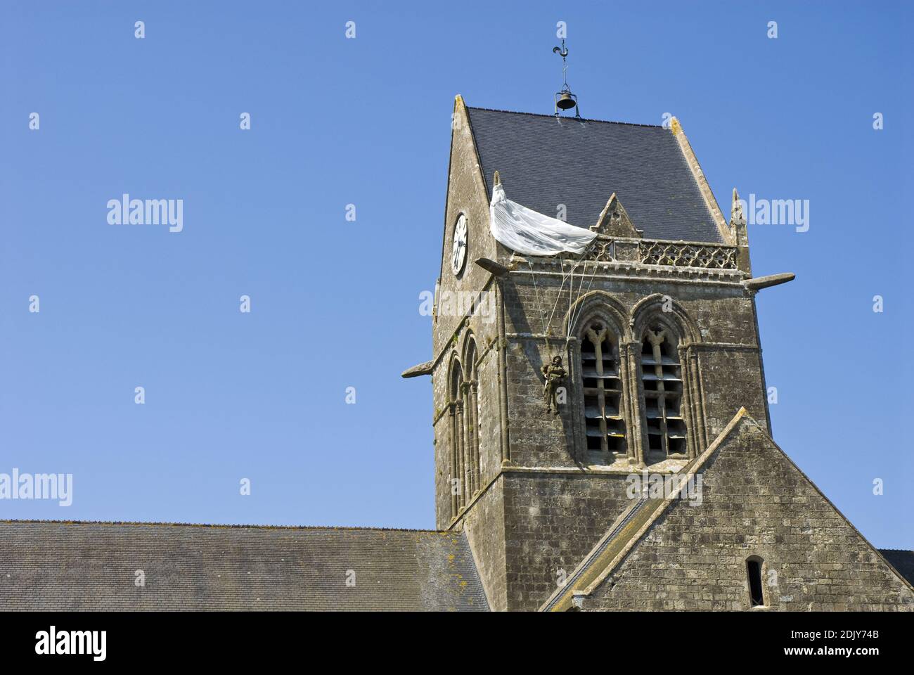 A Replica Paratrooper Hangs On The Church Tower At Sainte Mere Eglise
