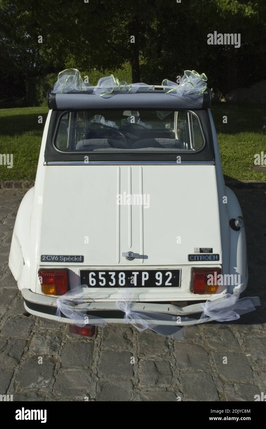 A small French car parked at the Chateau de Versailles, the Palace of ...