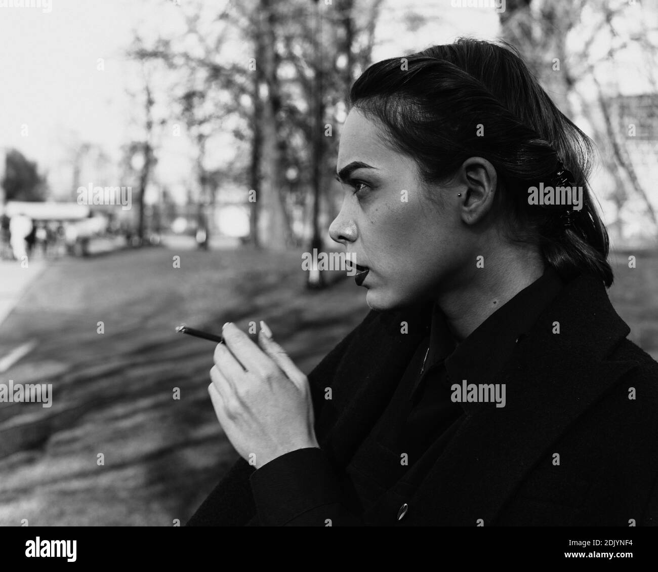 Woman Smoking Side View Black and White Stock Photos & Images - Alamy