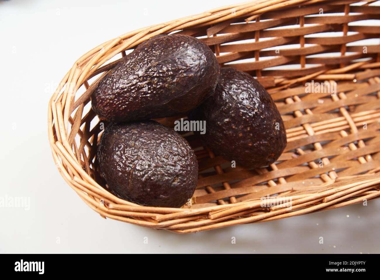 Table top view. Ripe avocados on a basket Stock Photo - Alamy