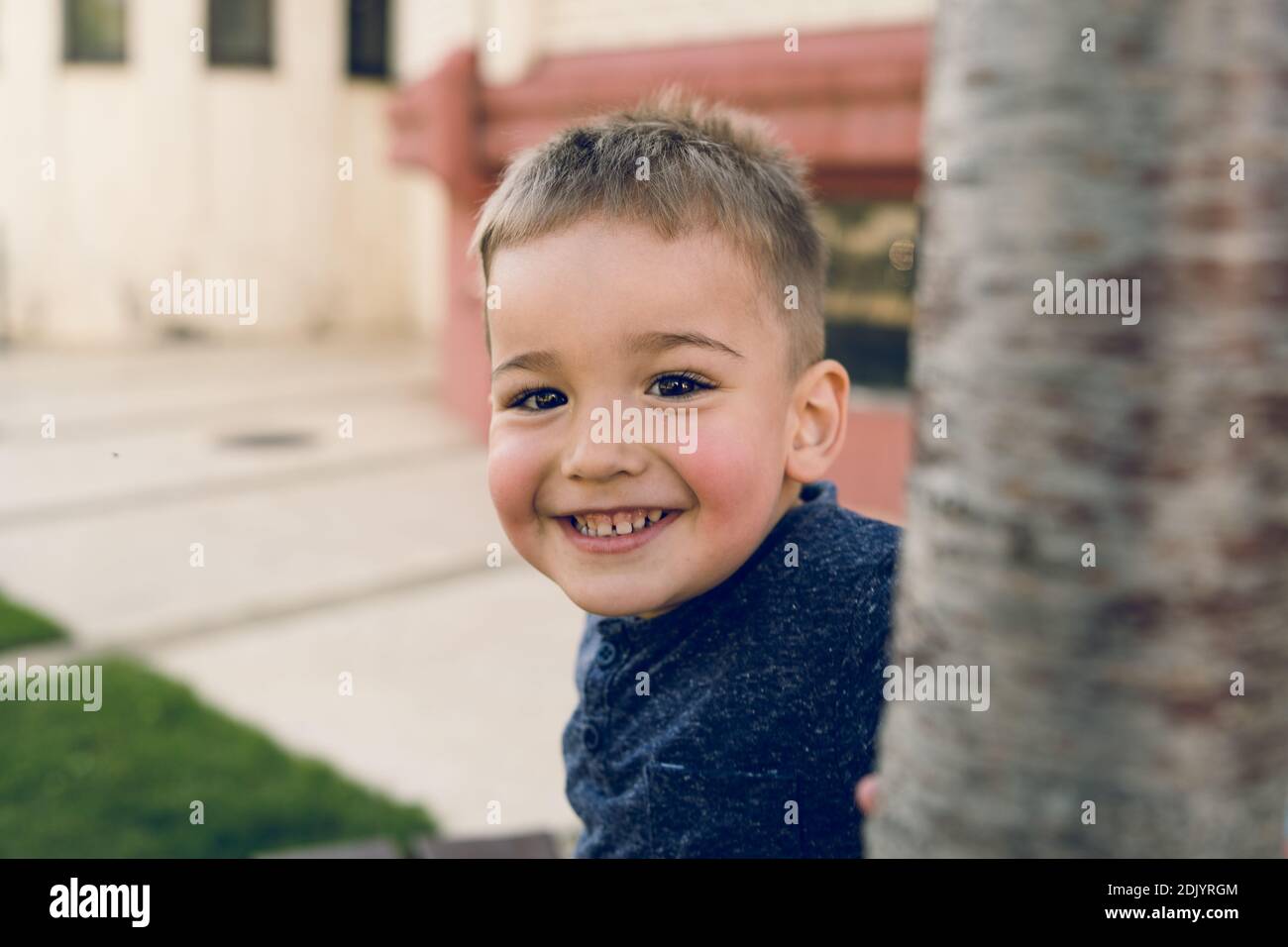 Boy Touching Tree Trunk High Resolution Stock Photography and Images ...