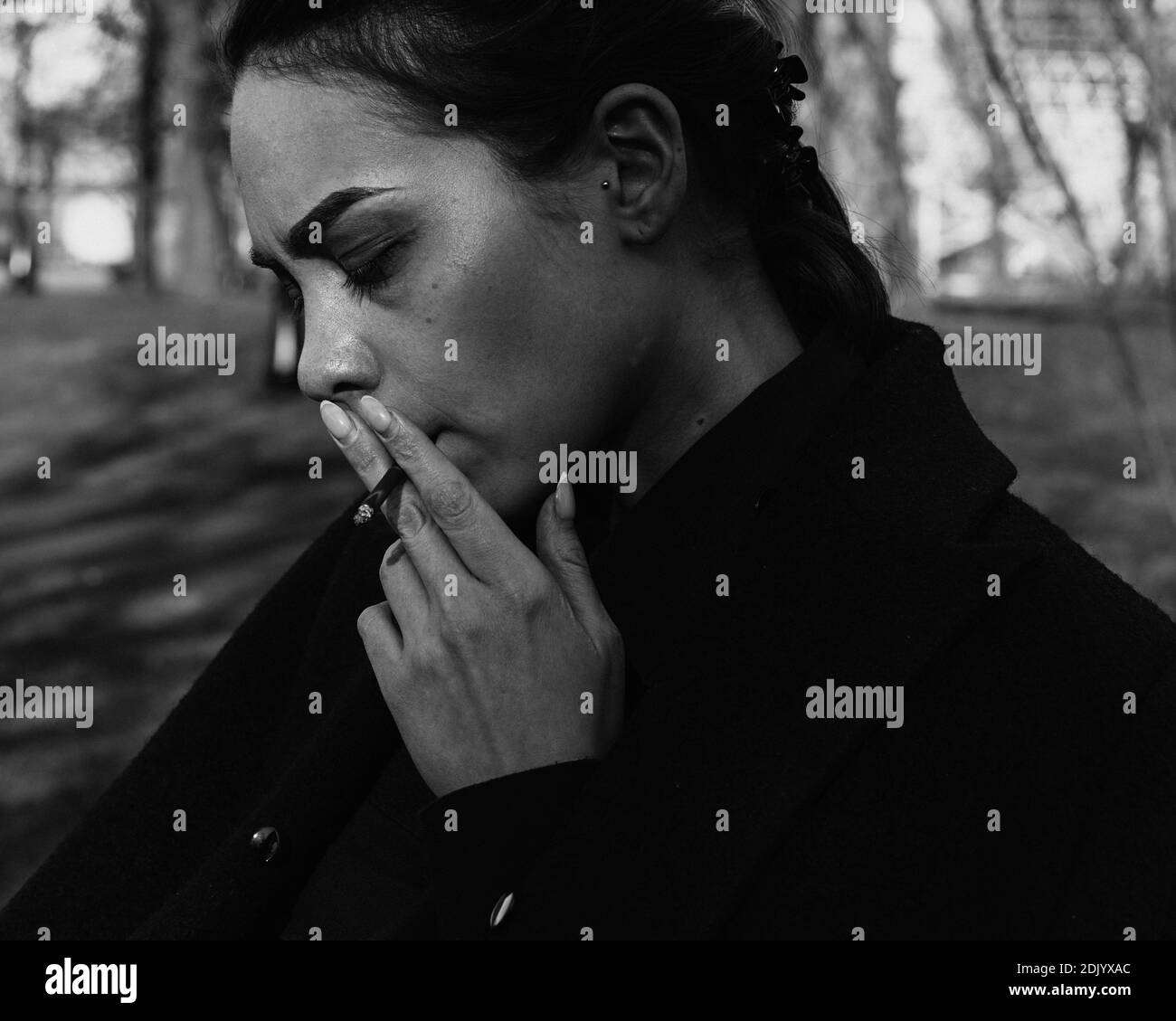 Woman Smoking Side View Black and White Stock Photos & Images - Alamy