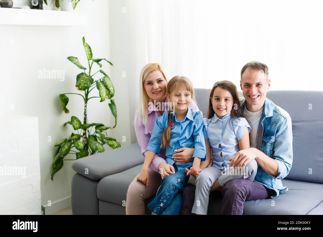 Portrait of a happy family smiling at home Stock Photo - Alamy