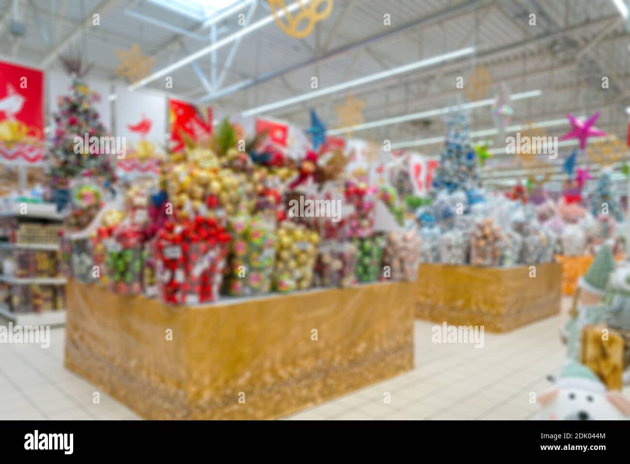 A blurred Christmas supermarket. Sale of festive Christmas accessories ...