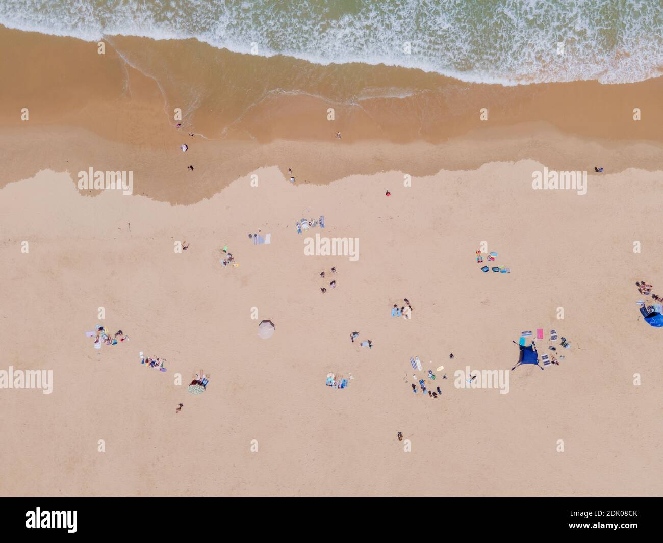 Group of people seen on beach from directly above Stock Photo - Alamy