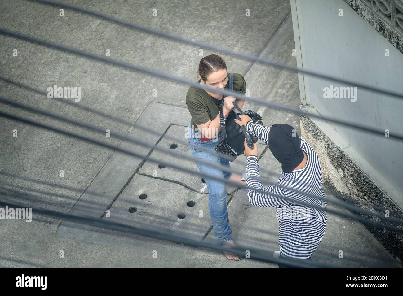 Criminal pointing gun thief hi-res stock photography and images - Alamy