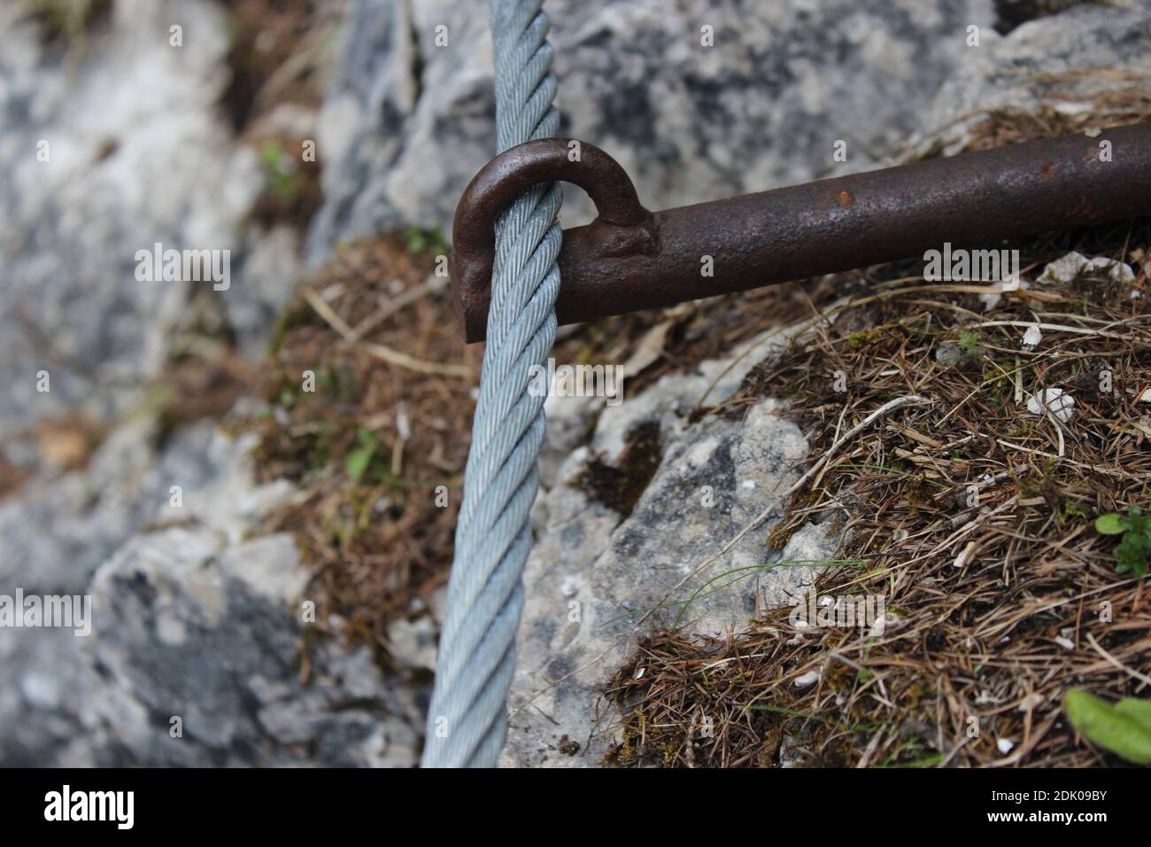 Steel rope hook fastening rock Stock Photo - Alamy