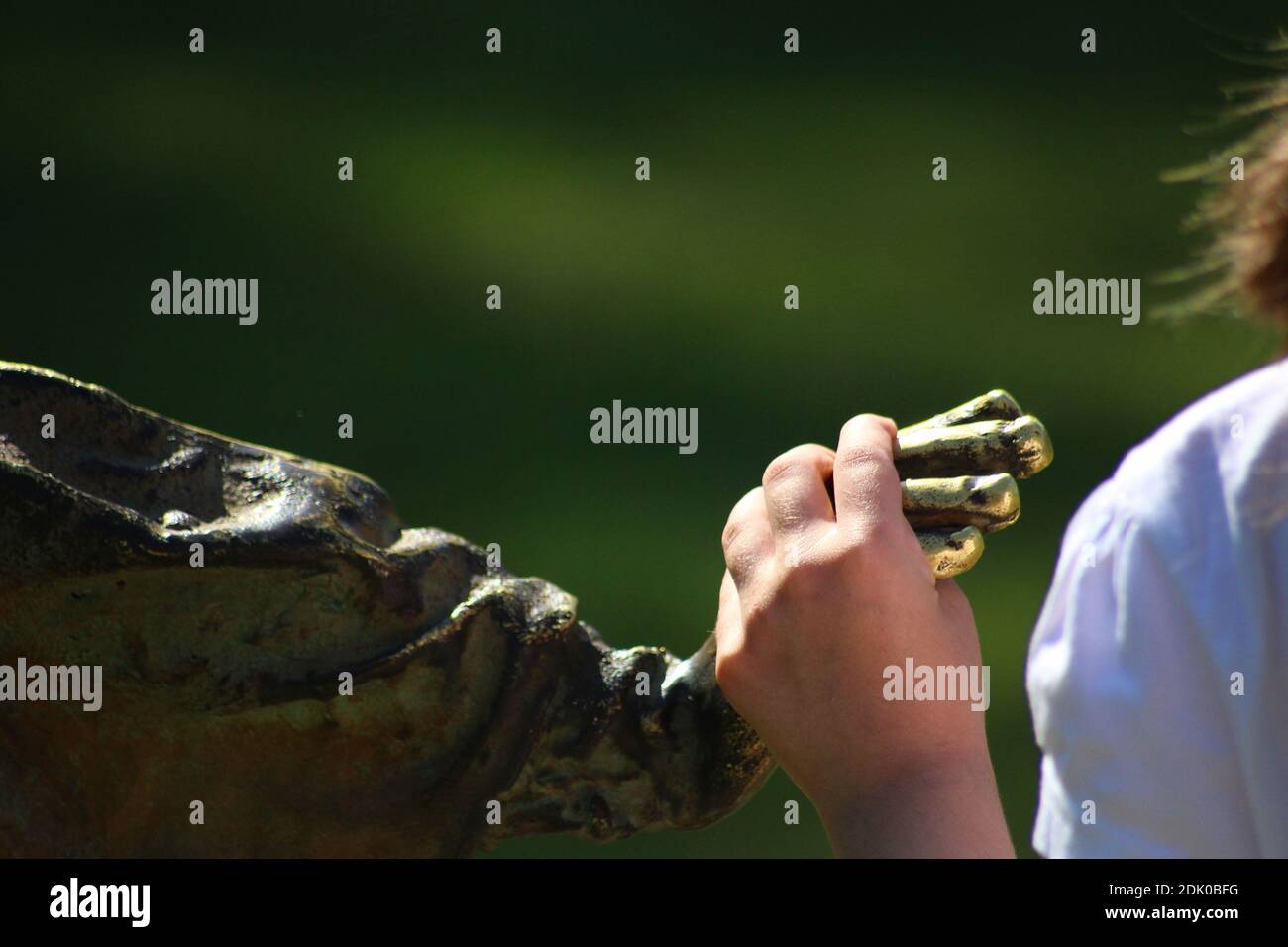 Child Touching Statue High Resolution Stock Photography and Images - Alamy