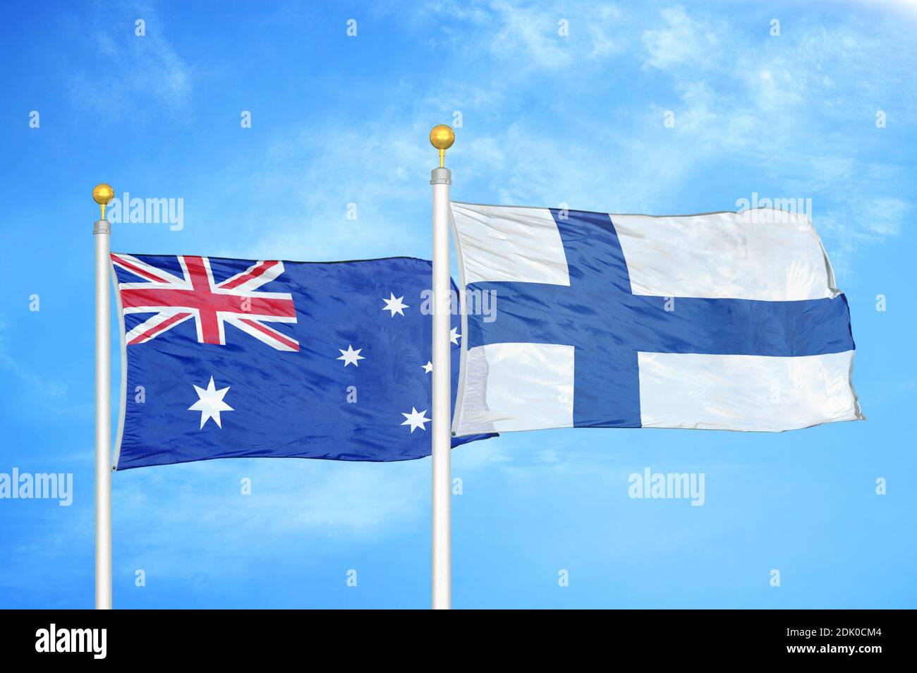 Australia and Finland two flags on flagpoles and blue cloudy sky Stock ...