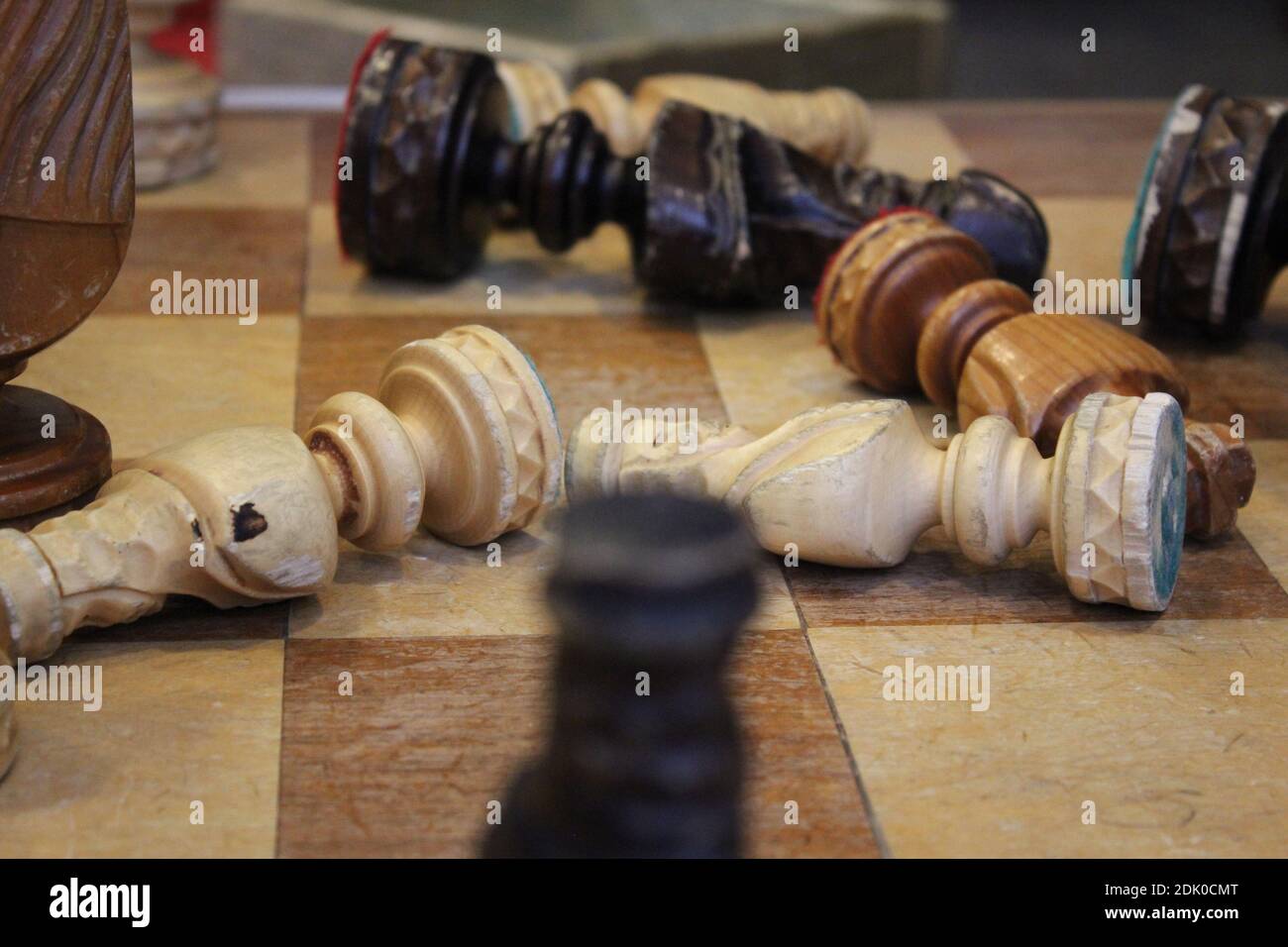 Chess pieces fell over Stock Photo - Alamy