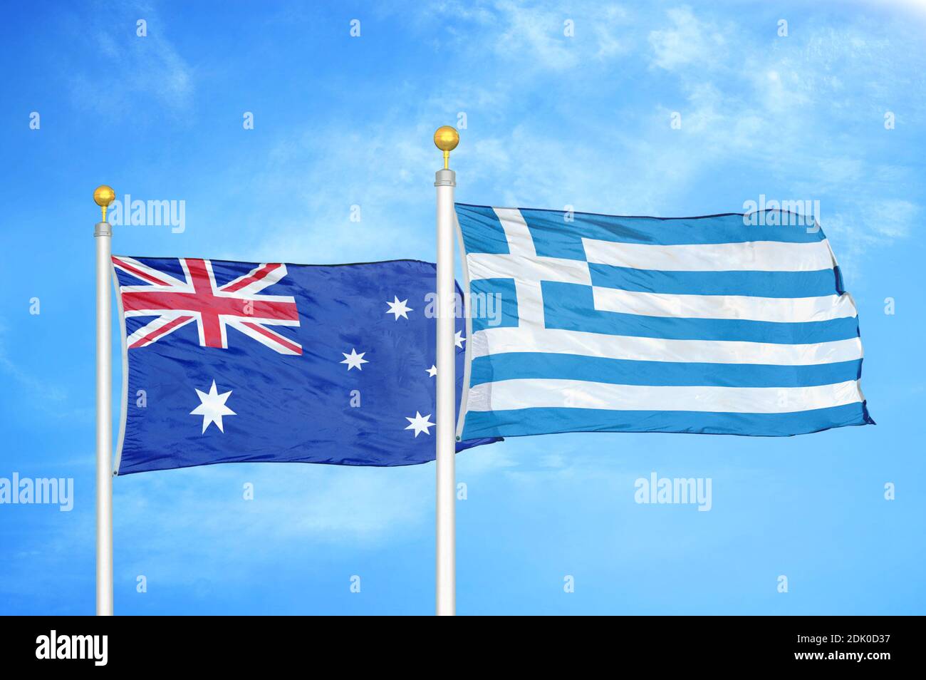 Australia and Greece two flags on flagpoles and blue cloudy sky Stock ...