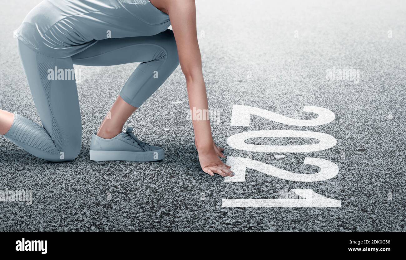 Runner woman ready to run on the 2021 line. Happy New Year 2021 Stock ...