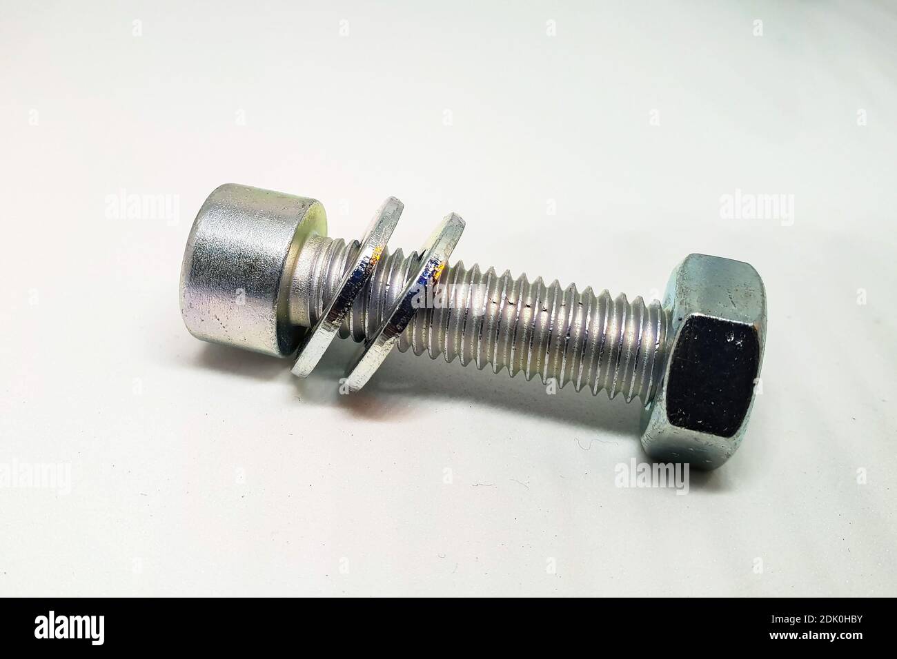A view of a group of bolt and nut isolated on a white background Stock ...