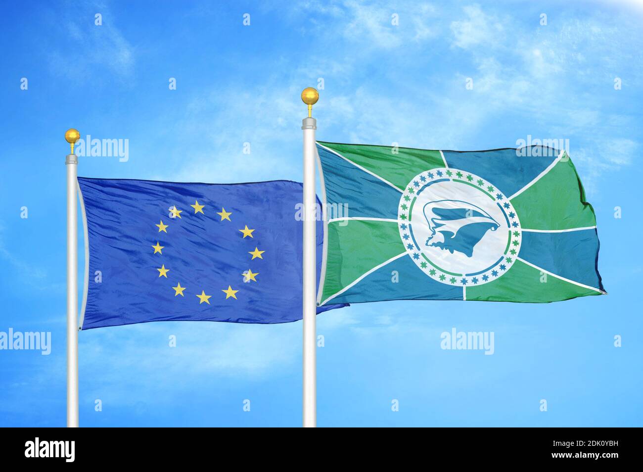 European Union and Martinique two flags on flagpoles and blue cloudy ...