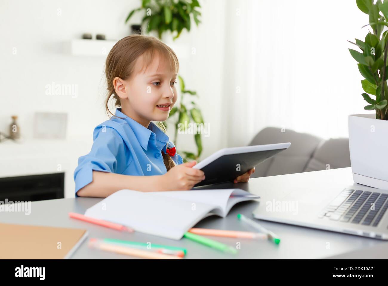 Remote lessons. The child smiles happily and gets knowledge remotely ...