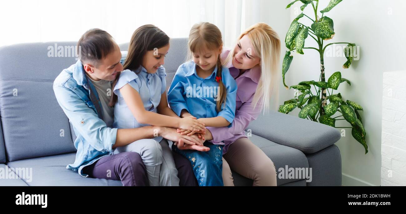 Portrait of a happy family smiling at home Stock Photo - Alamy
