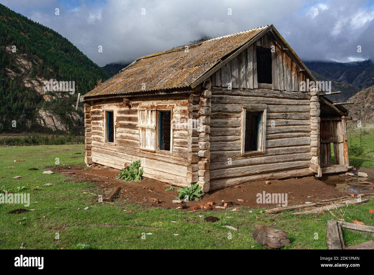 Beautiful wooden abandoned log house on mountains background Stock ...