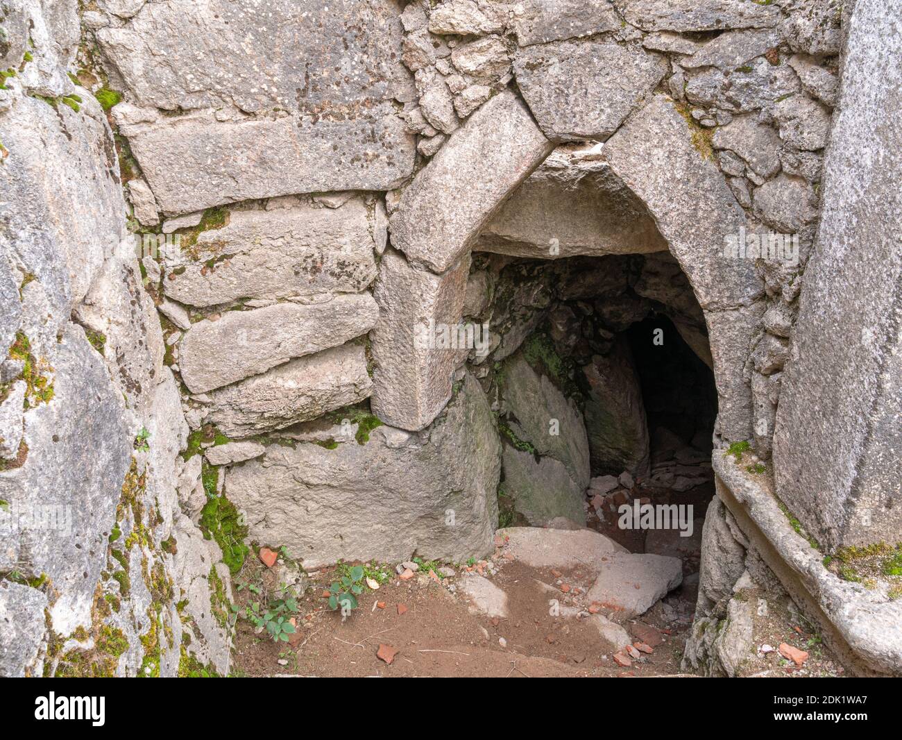 Old historical stone-made building ancient arch-shaped door opening ...
