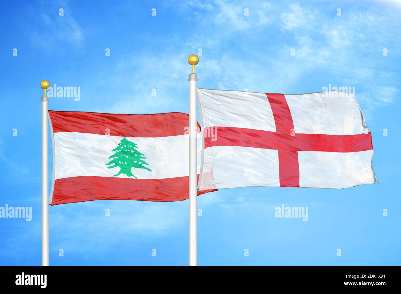 Lebanon and England two flags on flagpoles and blue cloudy sky Stock ...