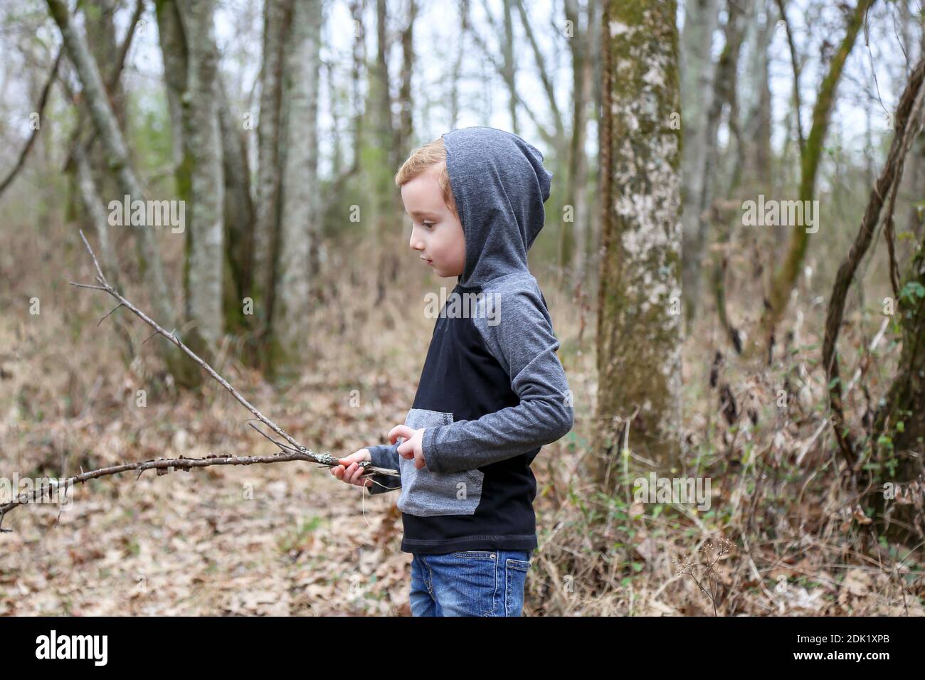 Boys holding sticks hi-res stock photography and images - Alamy