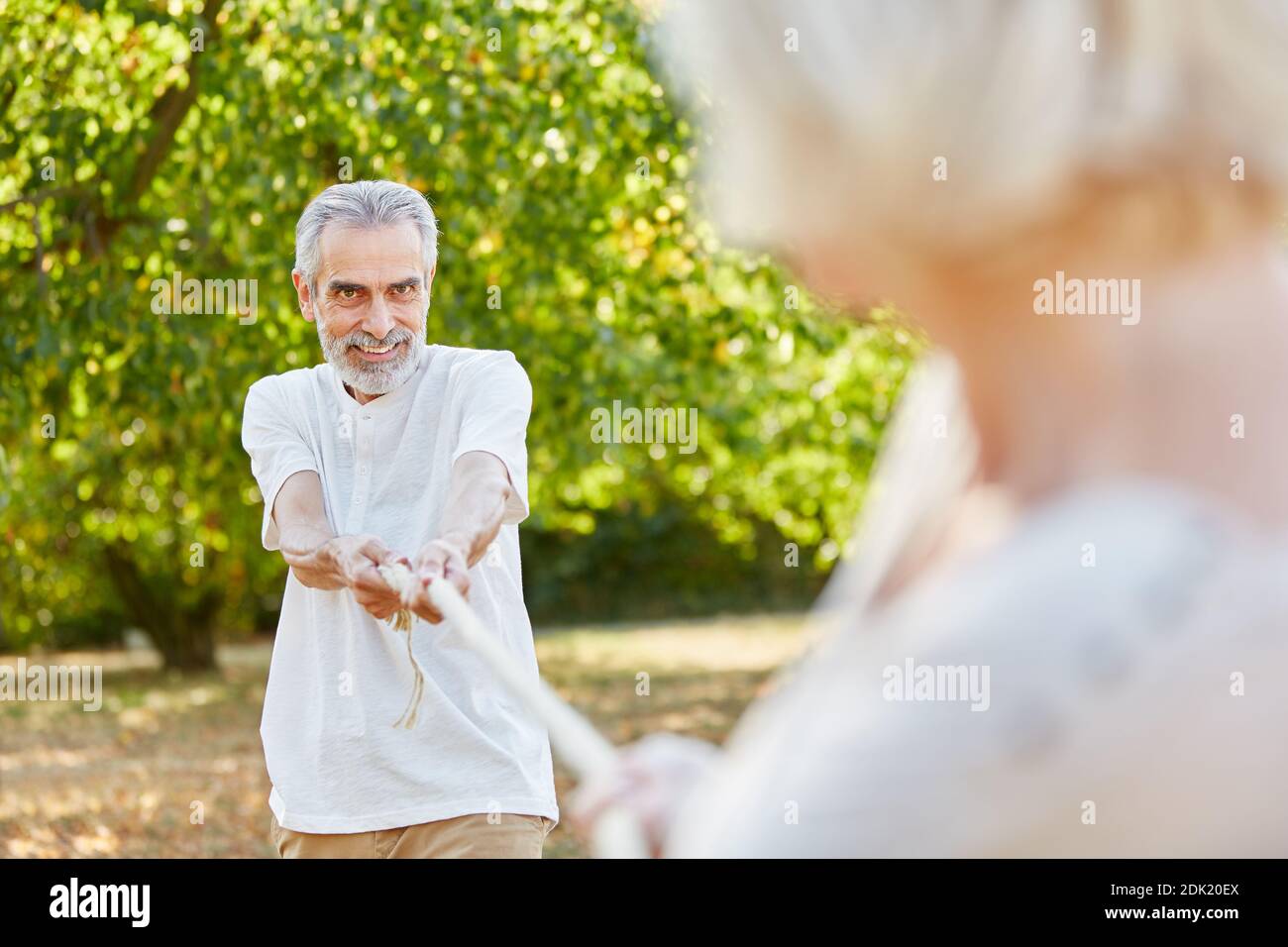 Two hands pulling rope hi-res stock photography and images - Alamy
