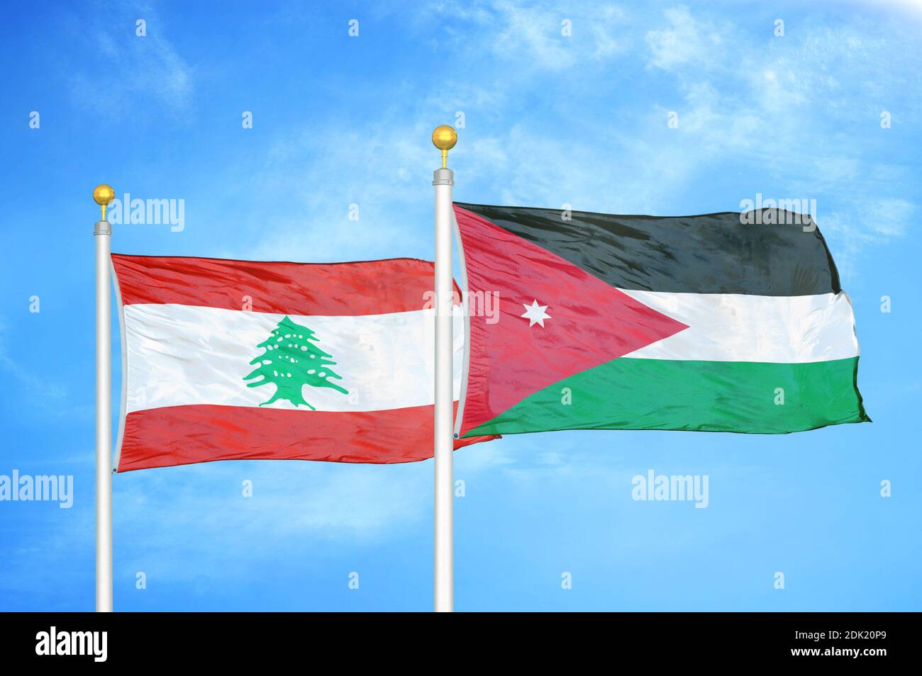 Lebanon and Jordan two flags on flagpoles and blue cloudy sky Stock ...