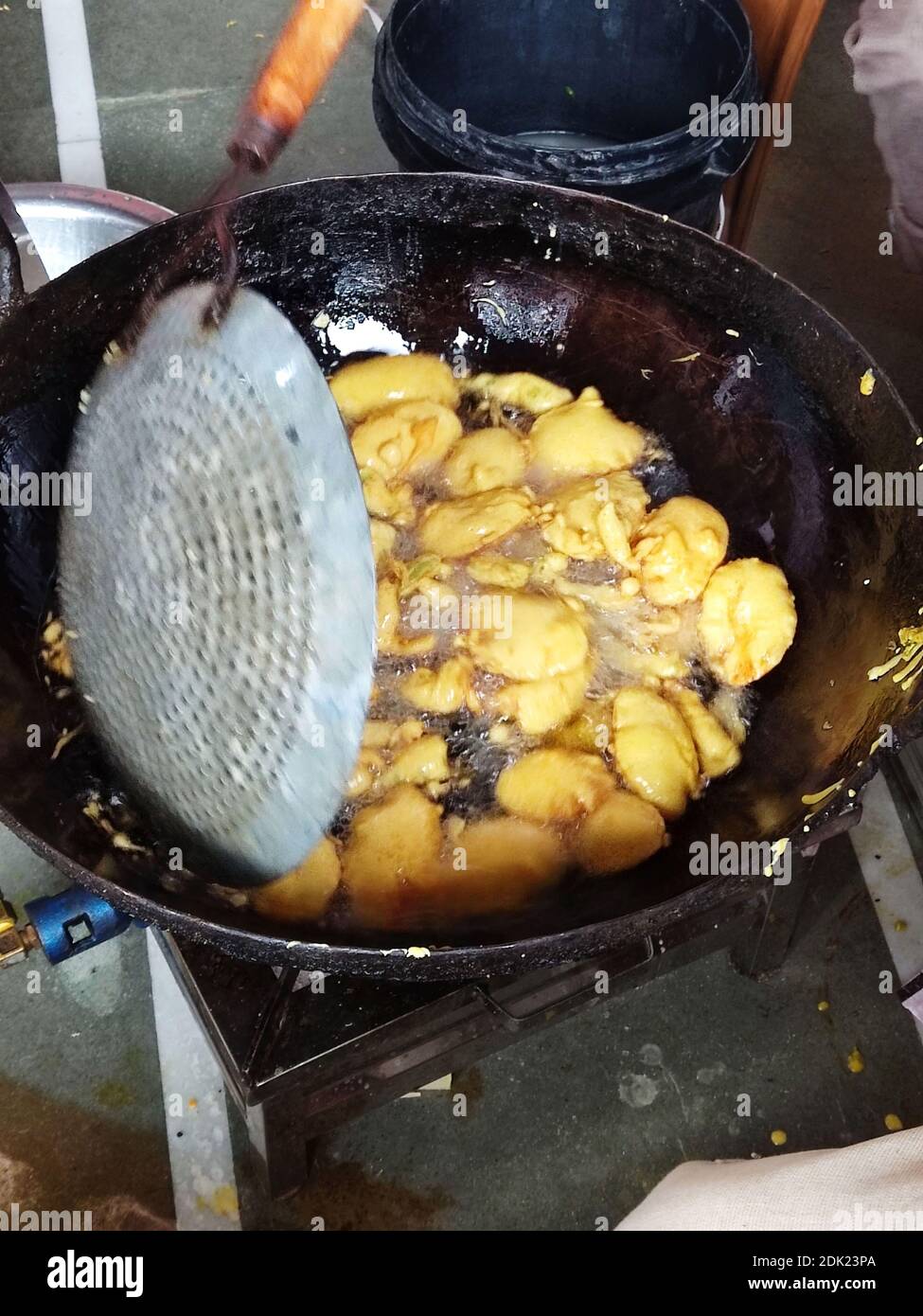 making of pakora in hot oil, Indian Fried Food Pakoda, Bhajiya, Bhajia ...
