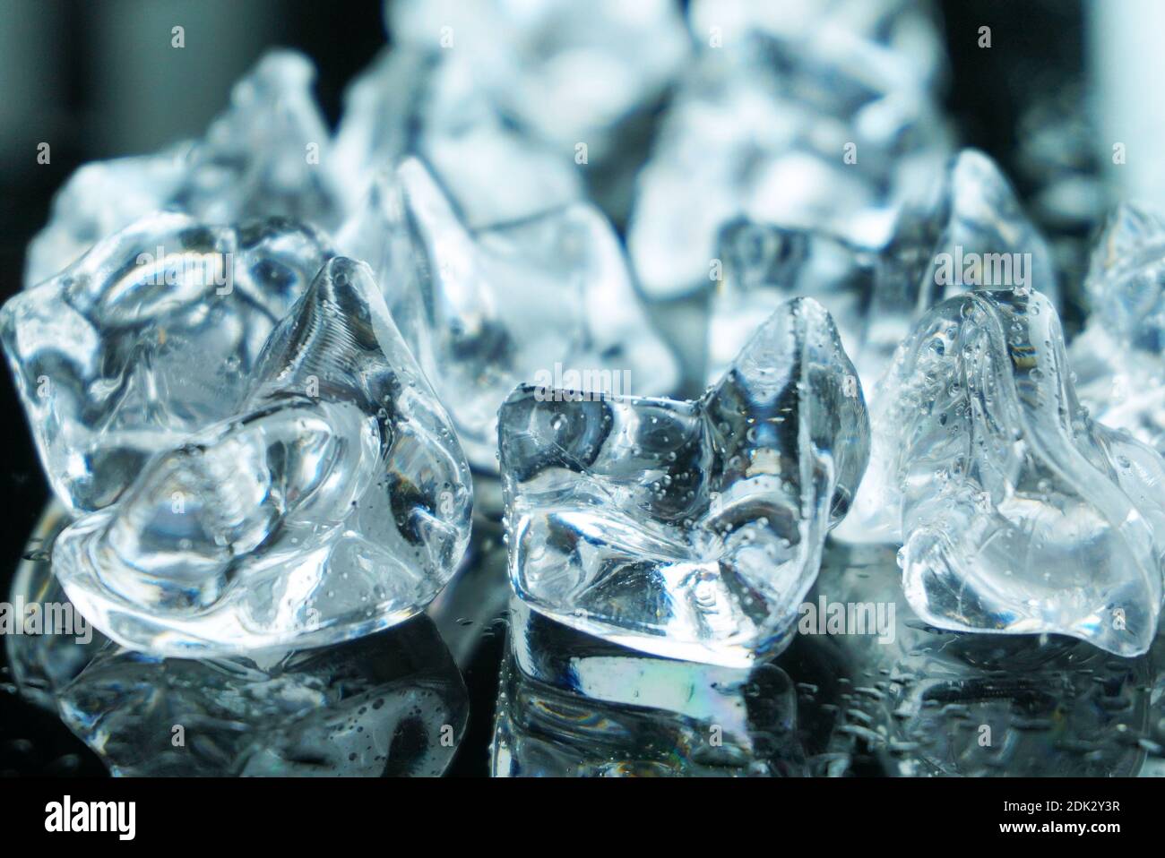 Group Of Ices With Water On The Slick Ground Stock Photo - Alamy