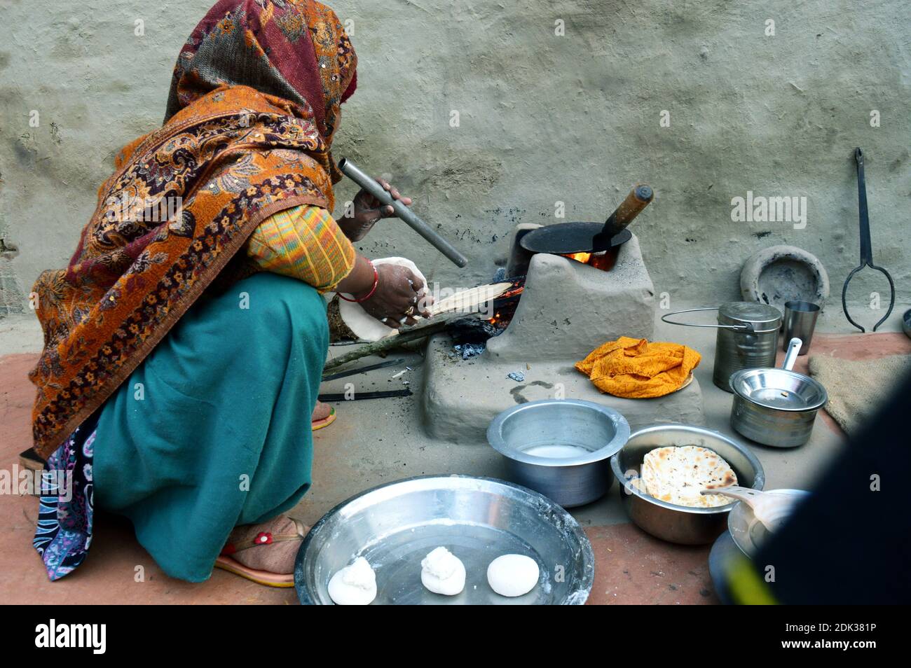Side View Full Length Of Woman Preparing Roti Stock Photo - Alamy