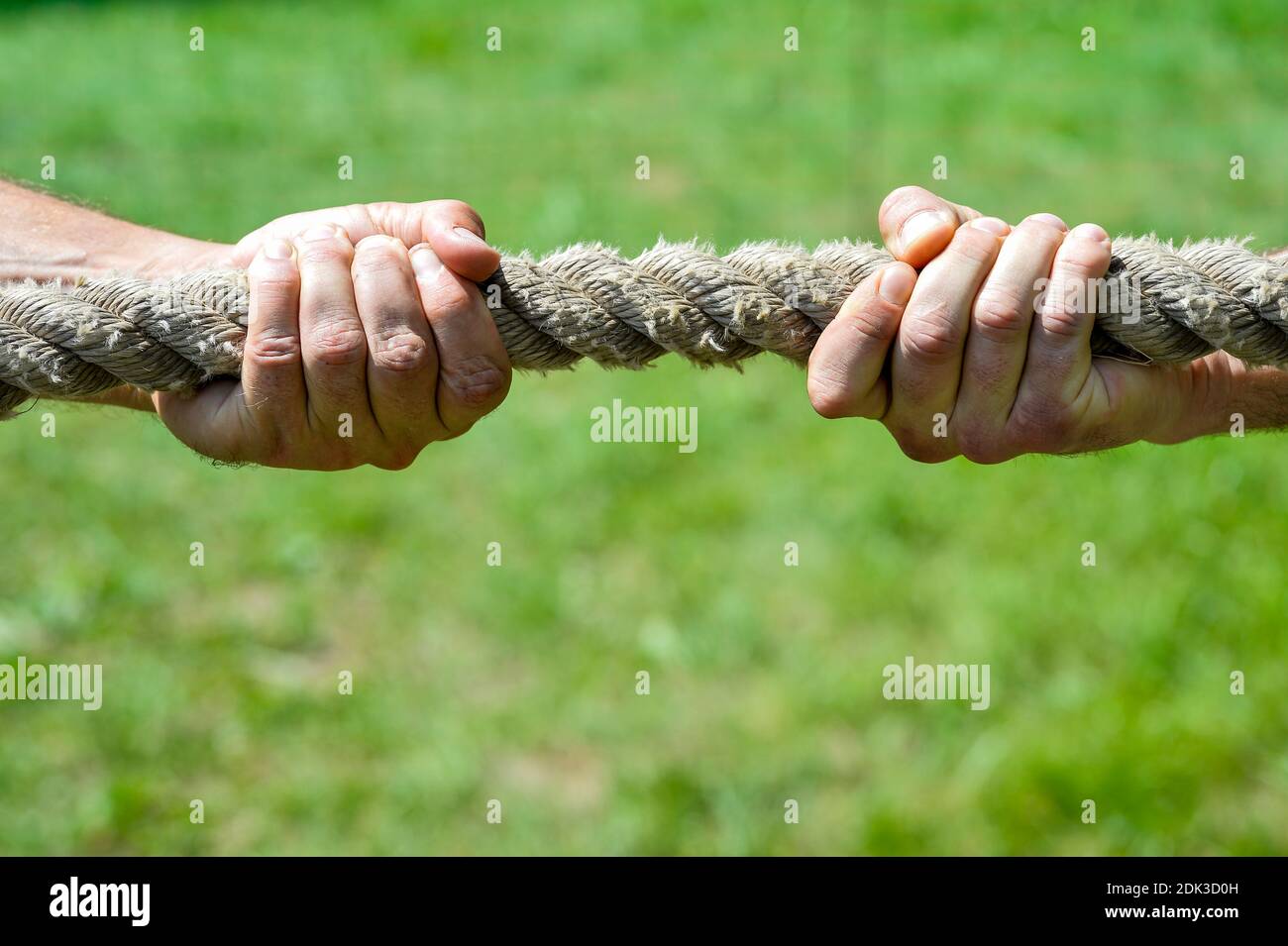 Two hands pulling rope hi-res stock photography and images - Alamy