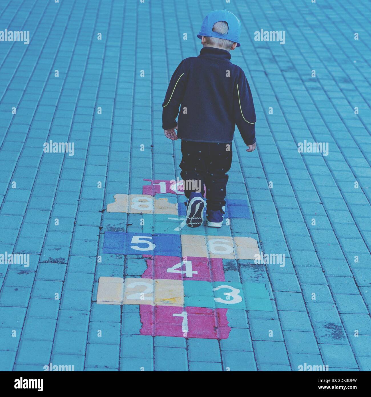 Boy playing hopscotch hi-res stock photography and images - Alamy