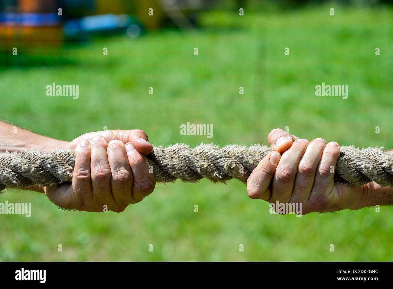Two hands pulling rope hi-res stock photography and images - Alamy