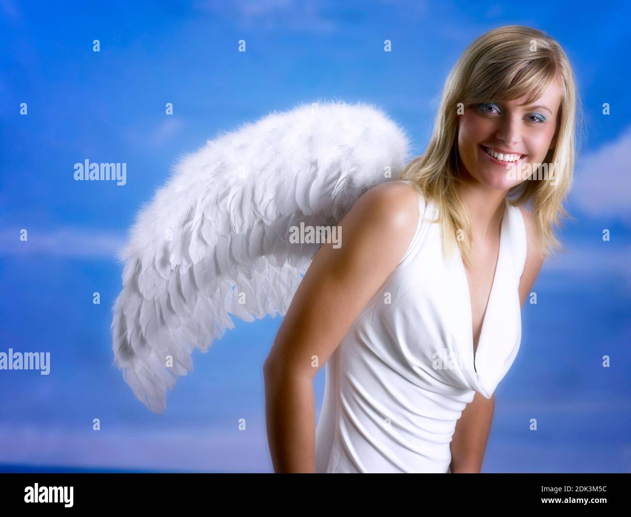 Young woman wearing angel wings hi-res stock photography and images - Alamy