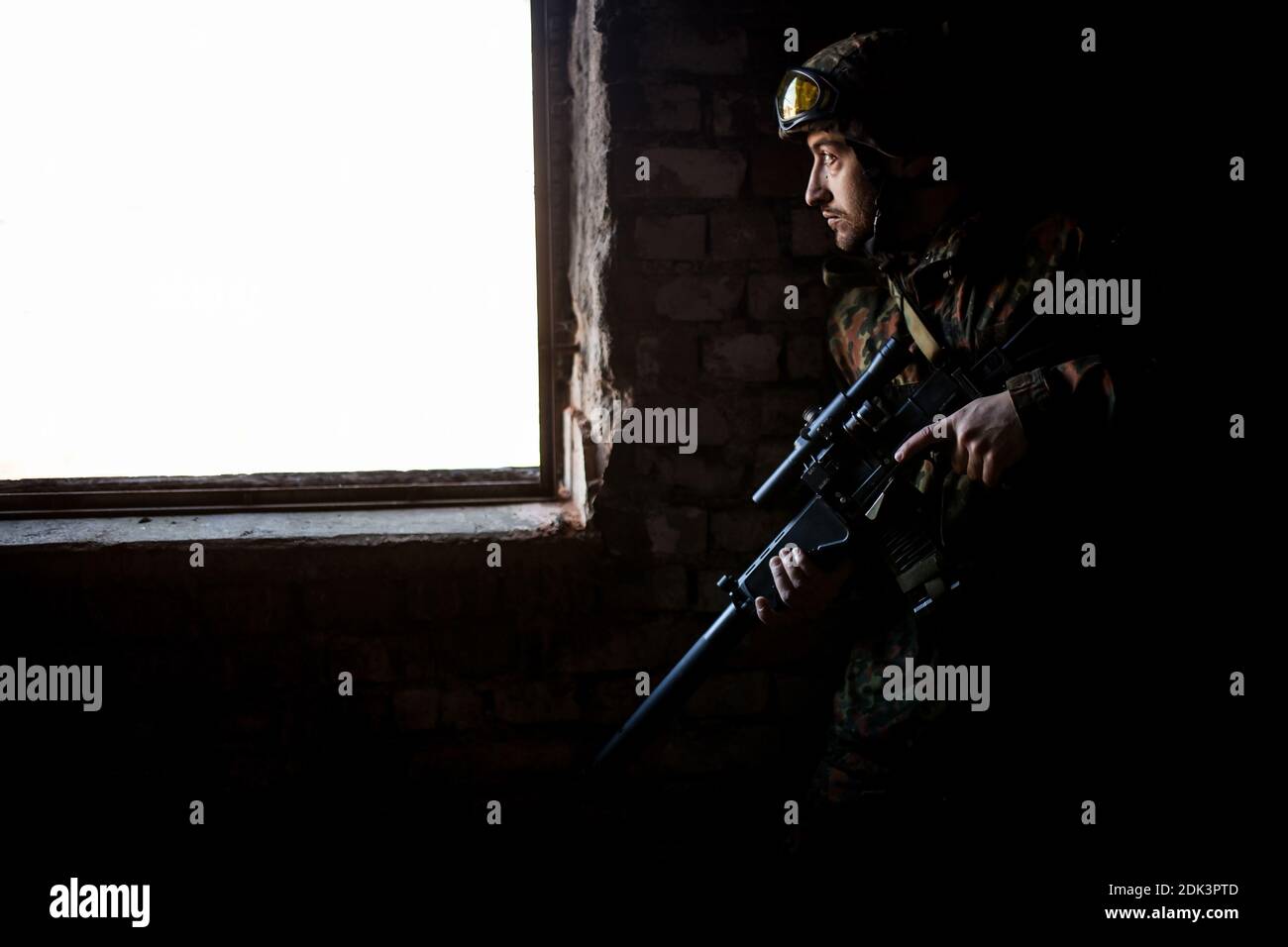 Army soldier weapon holding looking away hi-res stock photography and ...