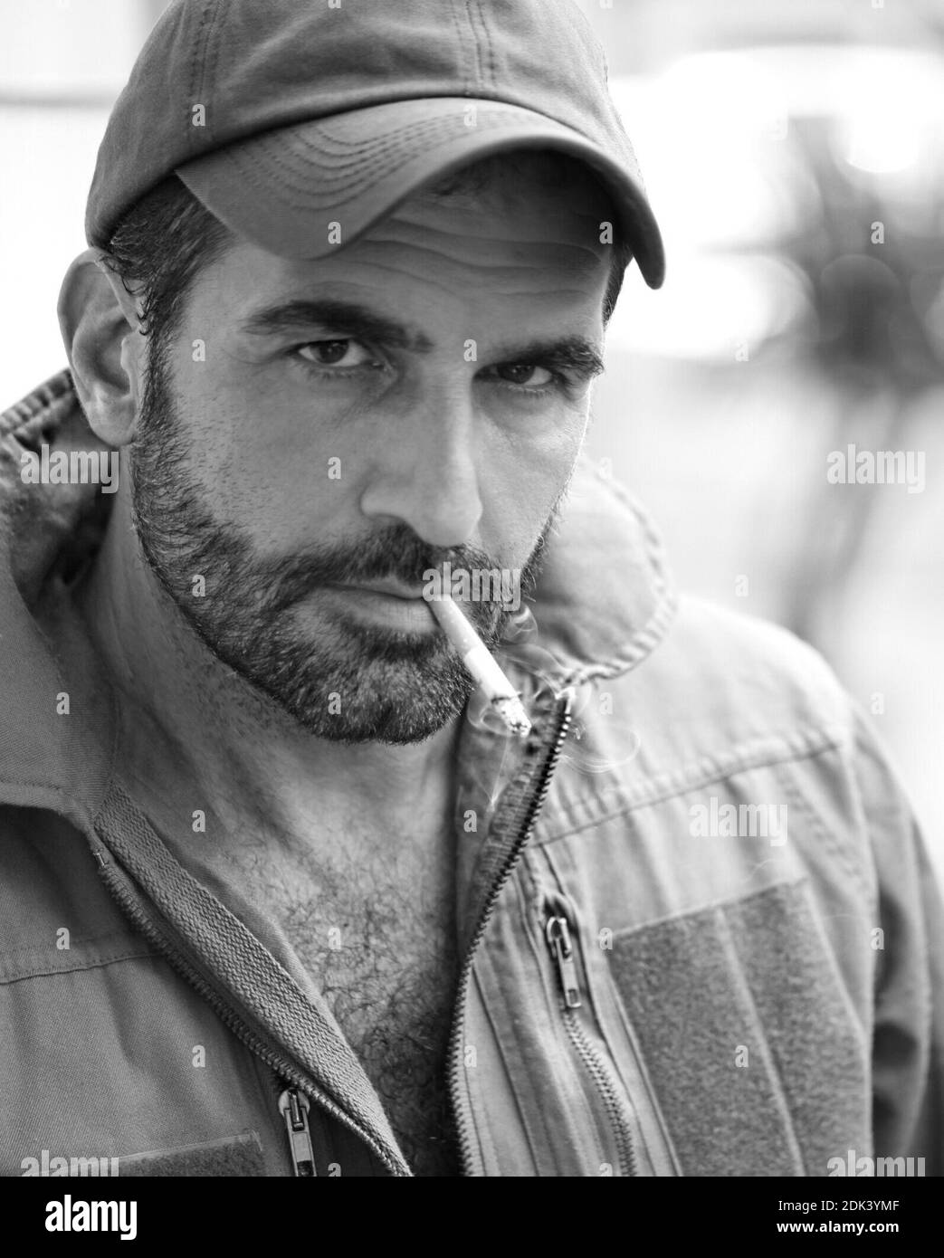 Handsome man smoking cigarette hi-res stock photography and images - Alamy