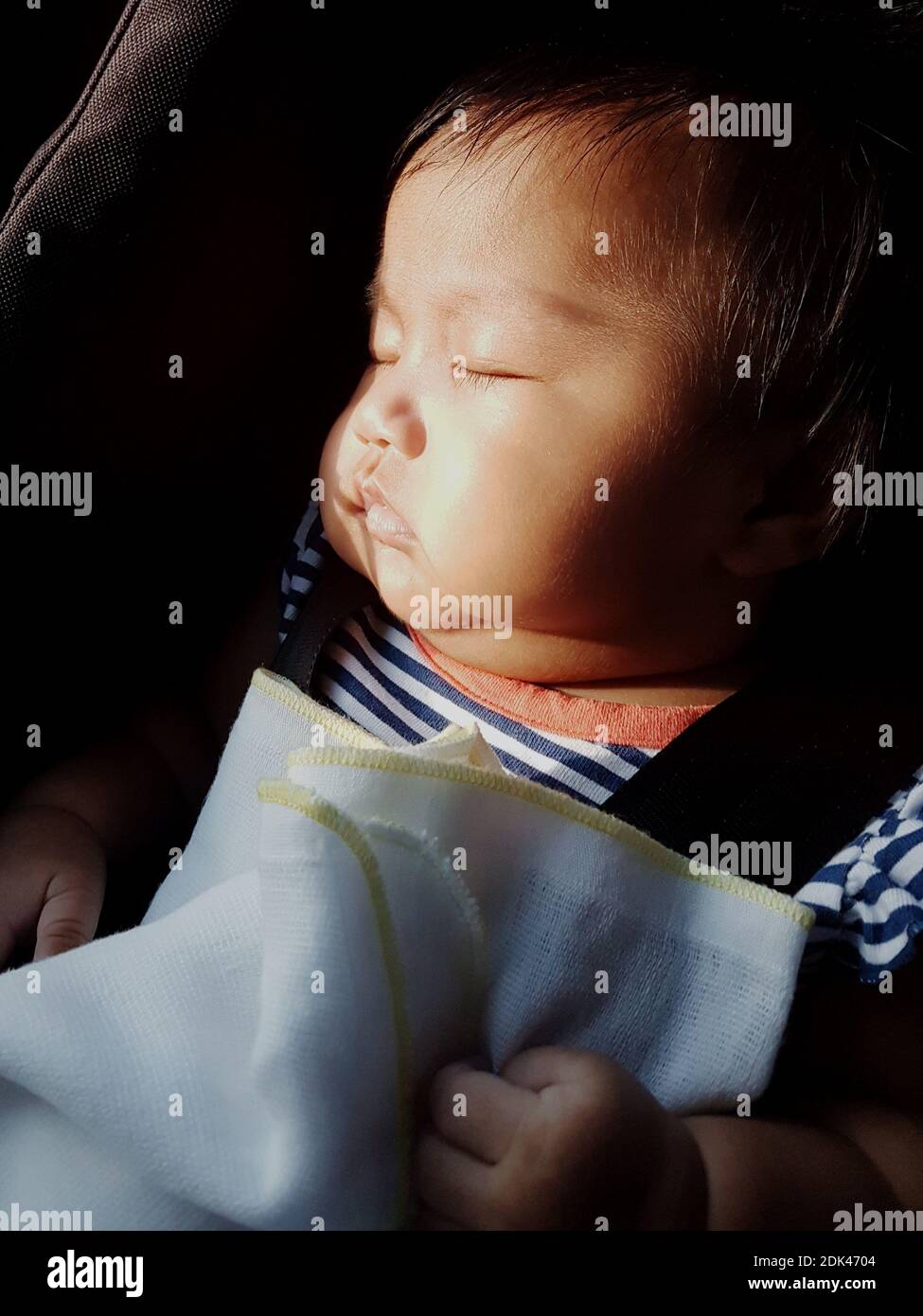 Baby girl sleeping in stroller hi-res stock photography and images - Alamy