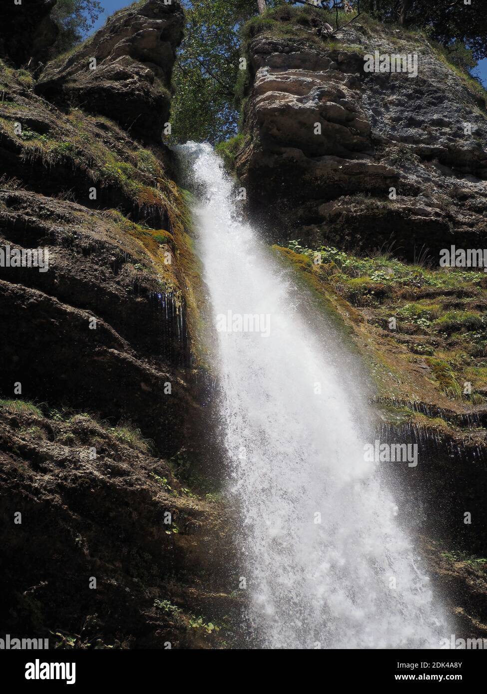 A beautiful scenery of the waterfall stream going through the rocks ...