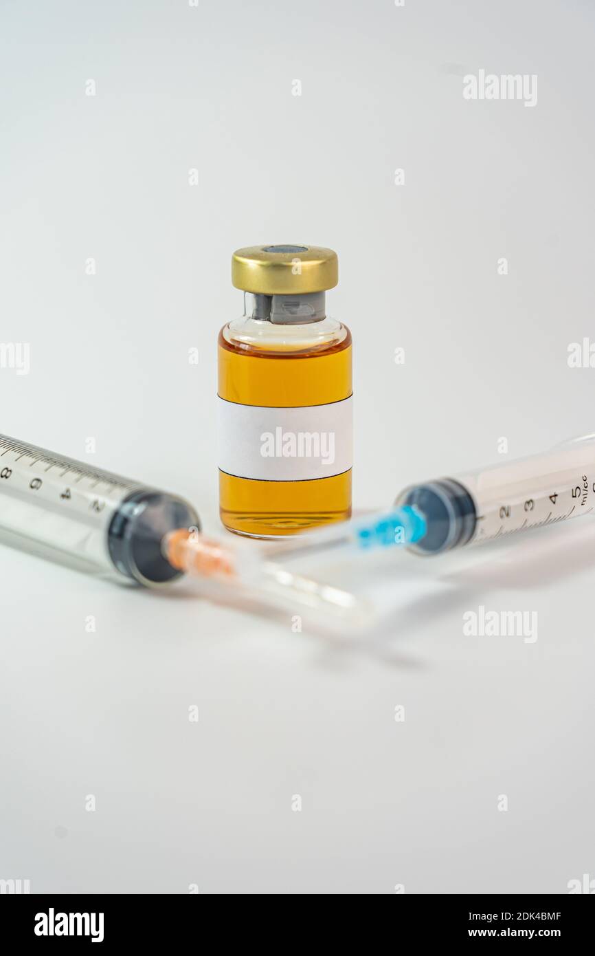 Blank label on vaccine bottle and medical syringe injection on white ...