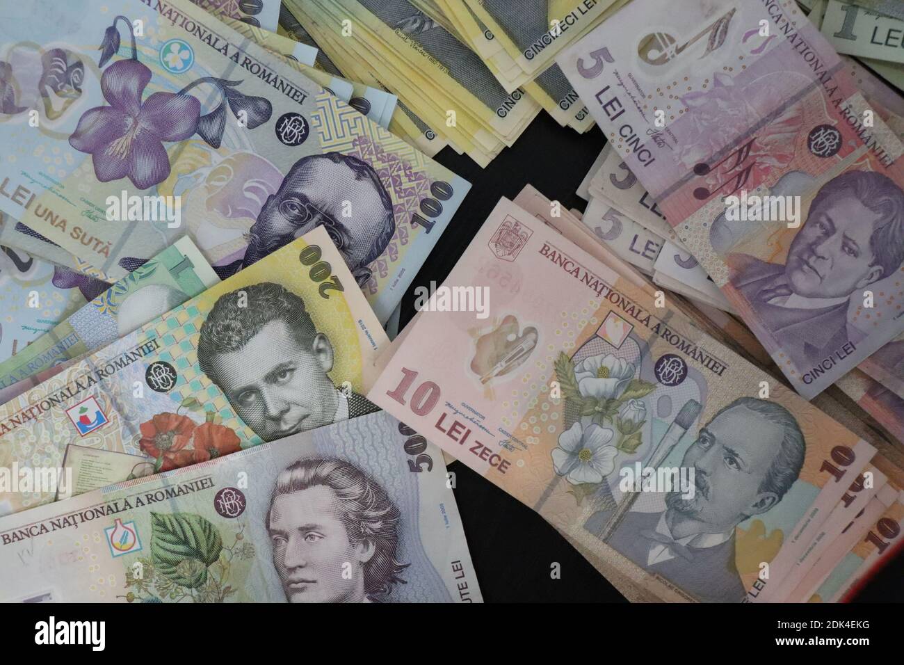 Romanian leu banknotes on a black backgr Stock Photo - Alamy