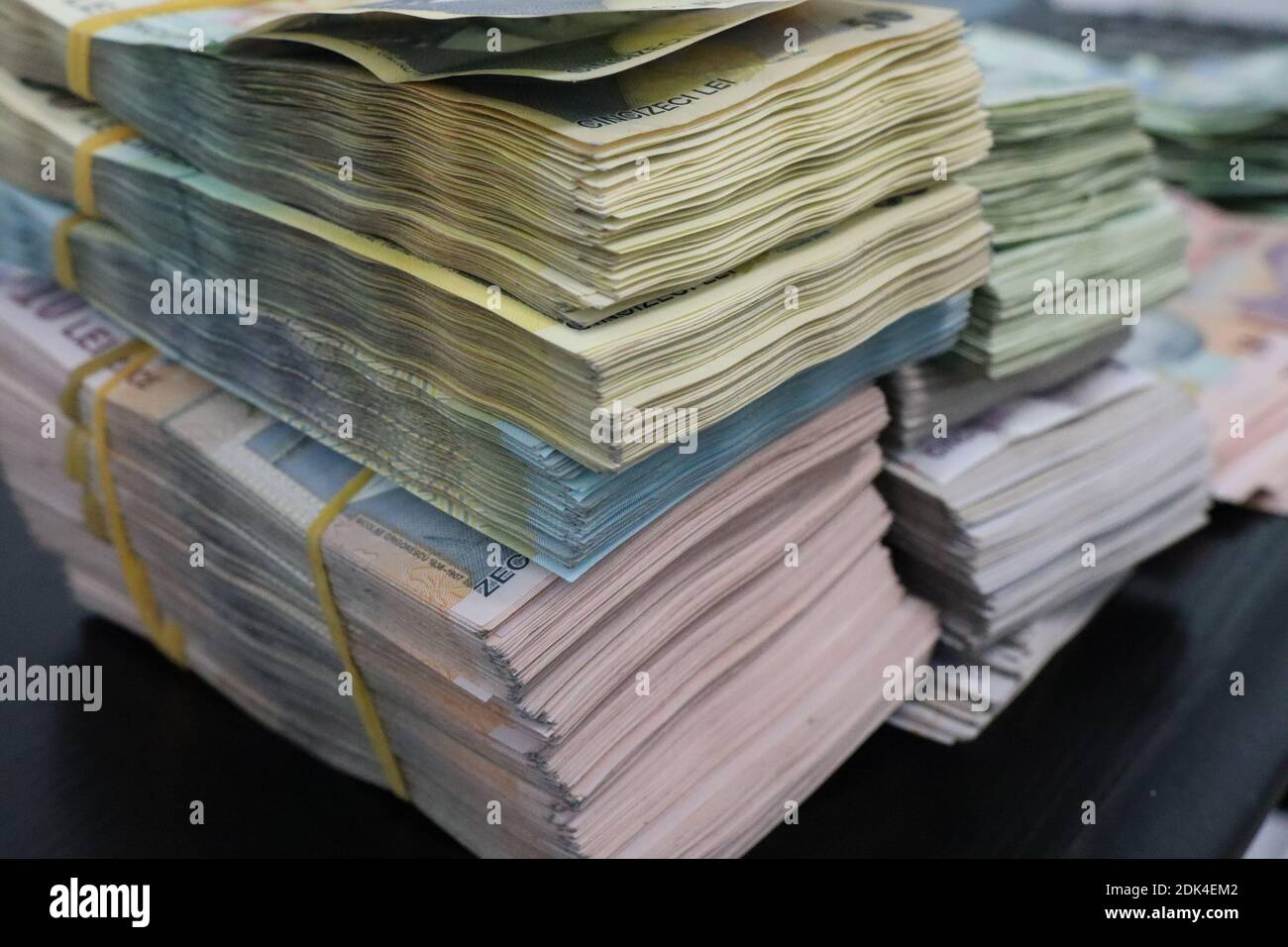 Romanian leu banknotes on a black background Stock Photo - Alamy