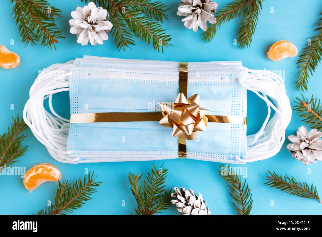 Hygienic face masks as a gift with a golden ribbon and decorations, top ...