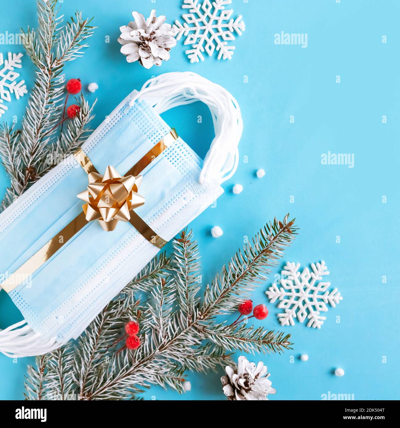 Hygienic face masks as a gift with a golden ribbon, top view ...